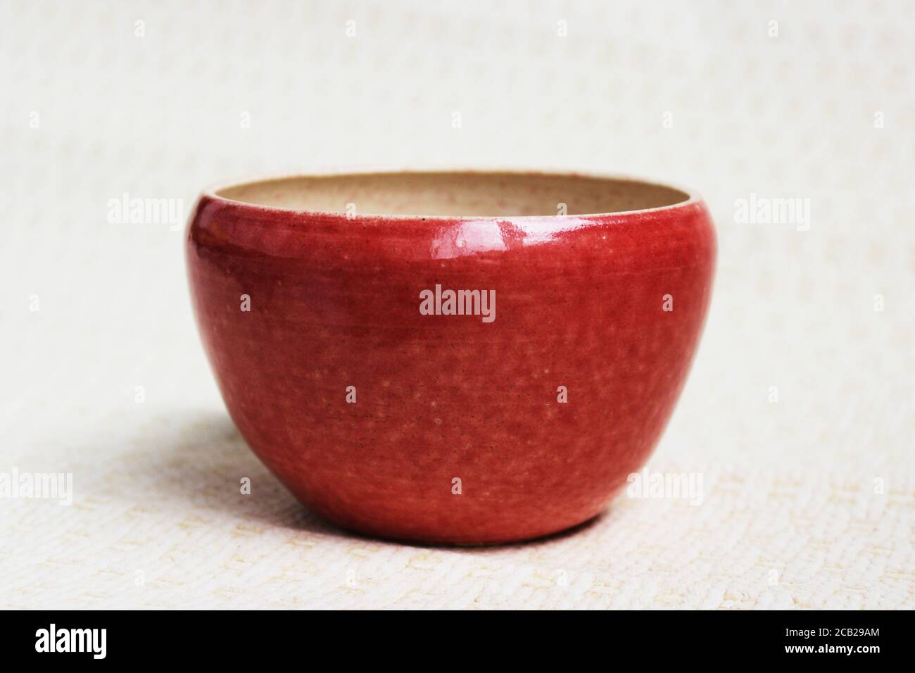 red deep bowl for food. handmade ceramics. made on a potter's wheel ...