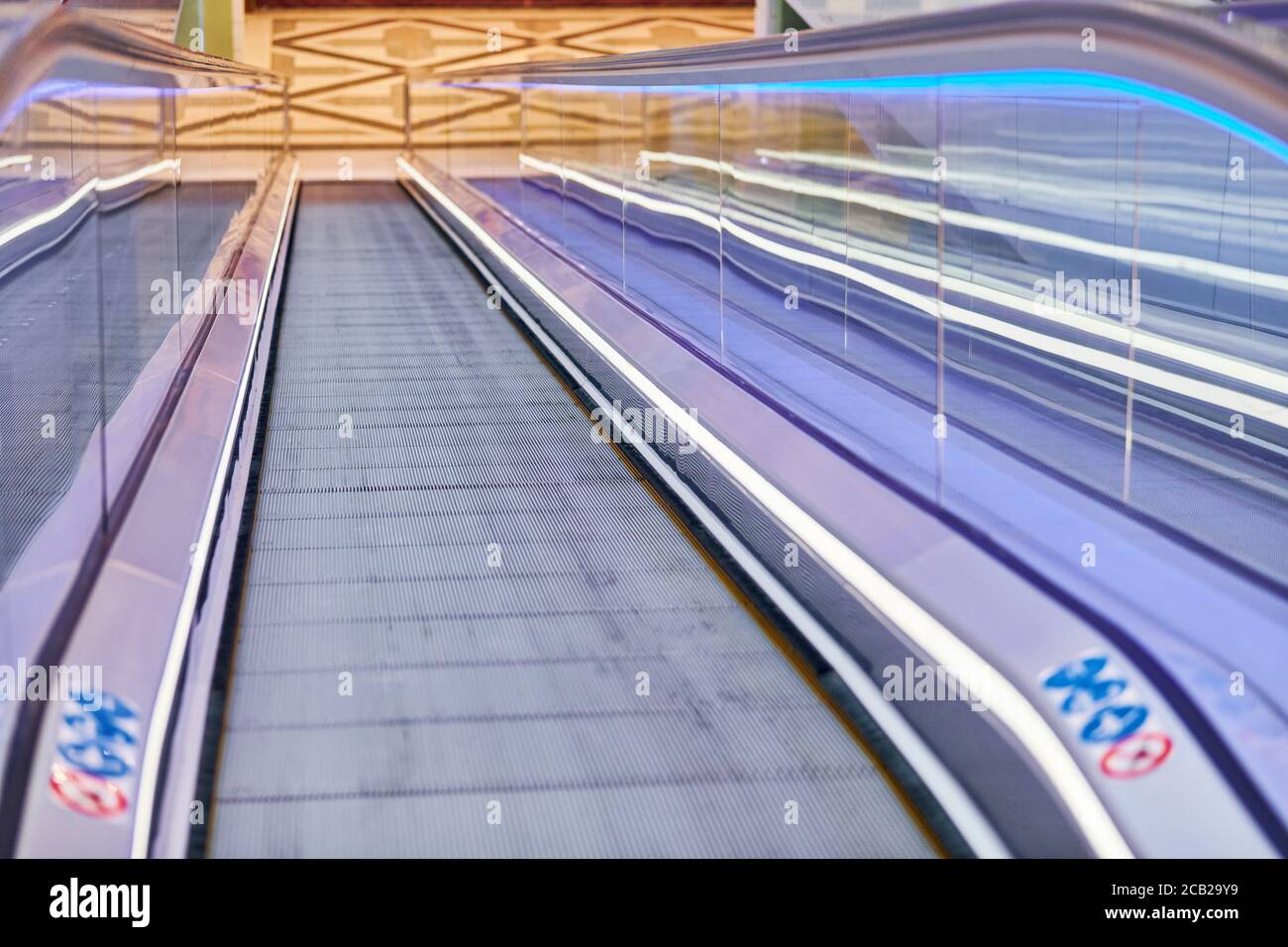 Moving walkway in shopping center. Horizontal slow-moving conveyor ...