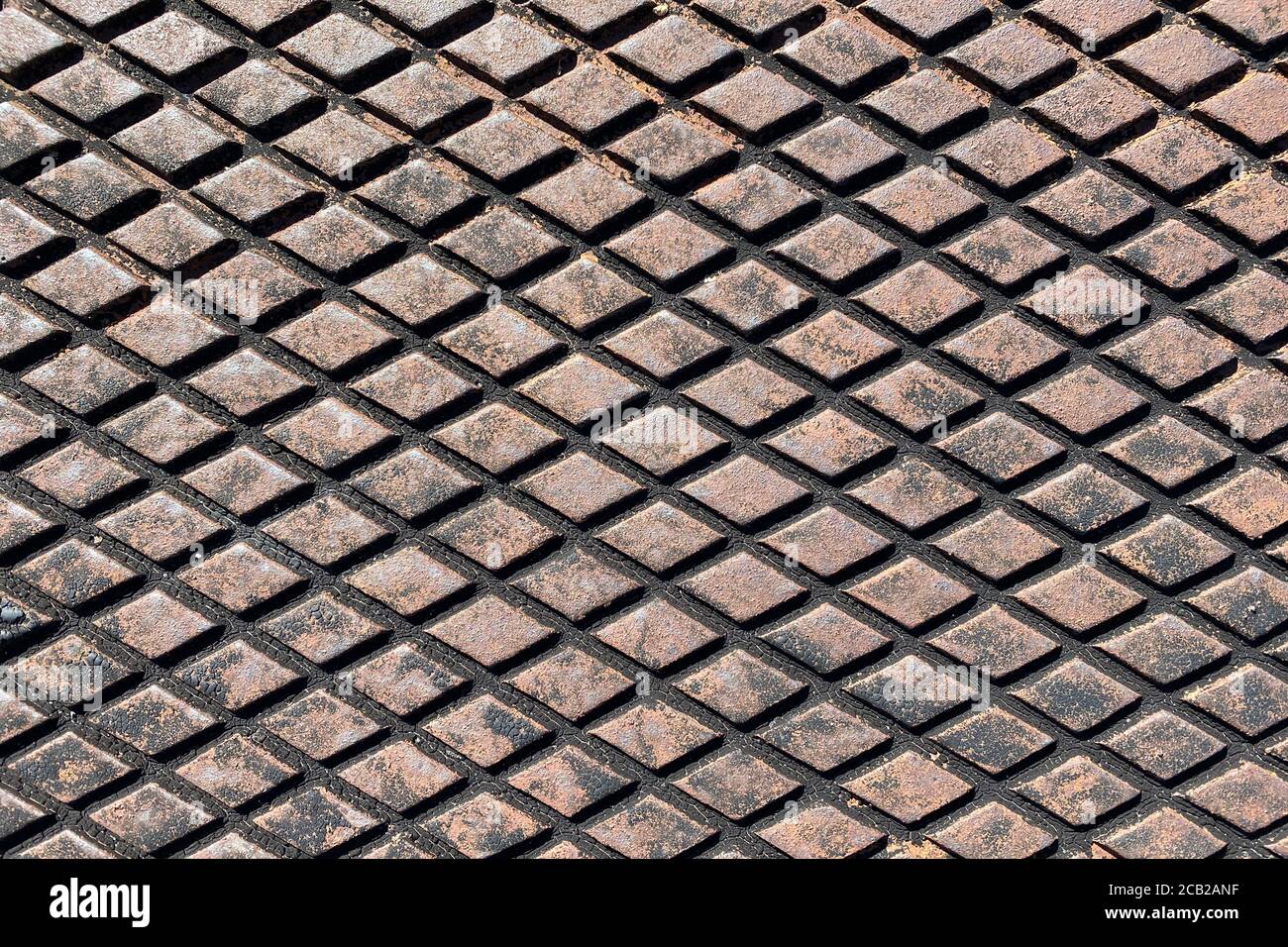 rusty retro wide angle view diamond plate storm drain cover suitable ...