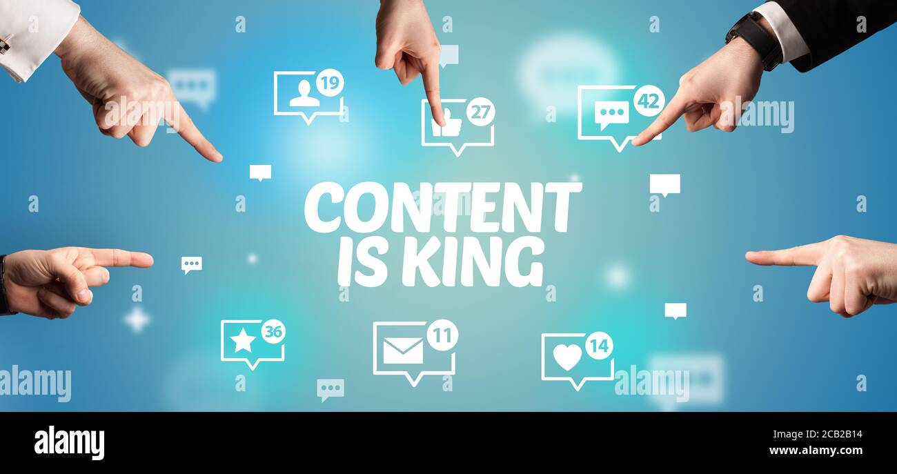 Close-Up of cropped hand pointing at CONTENT IS KING inscription ...