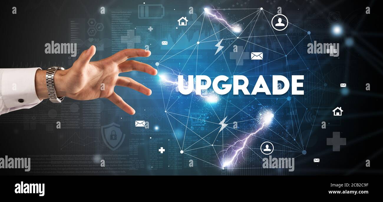 Hand pointing at UPGRADE inscription, modern technology concept Stock ...