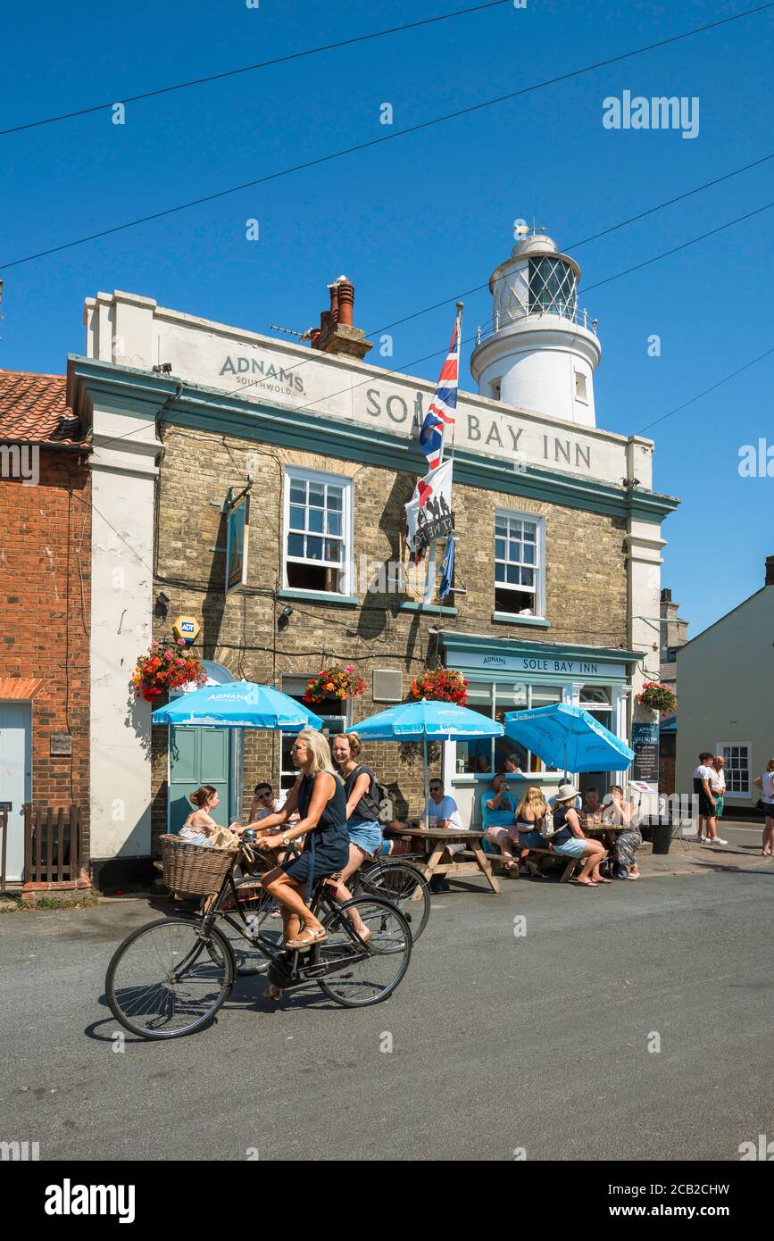 Southwold town pub, view in summer of people drinking outside the ...