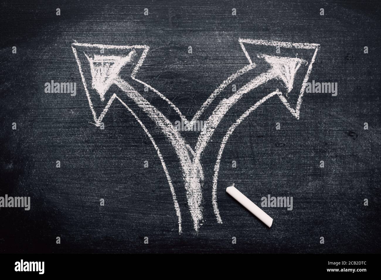 Two direction arrows as concept of choice and making decision, chalk ...