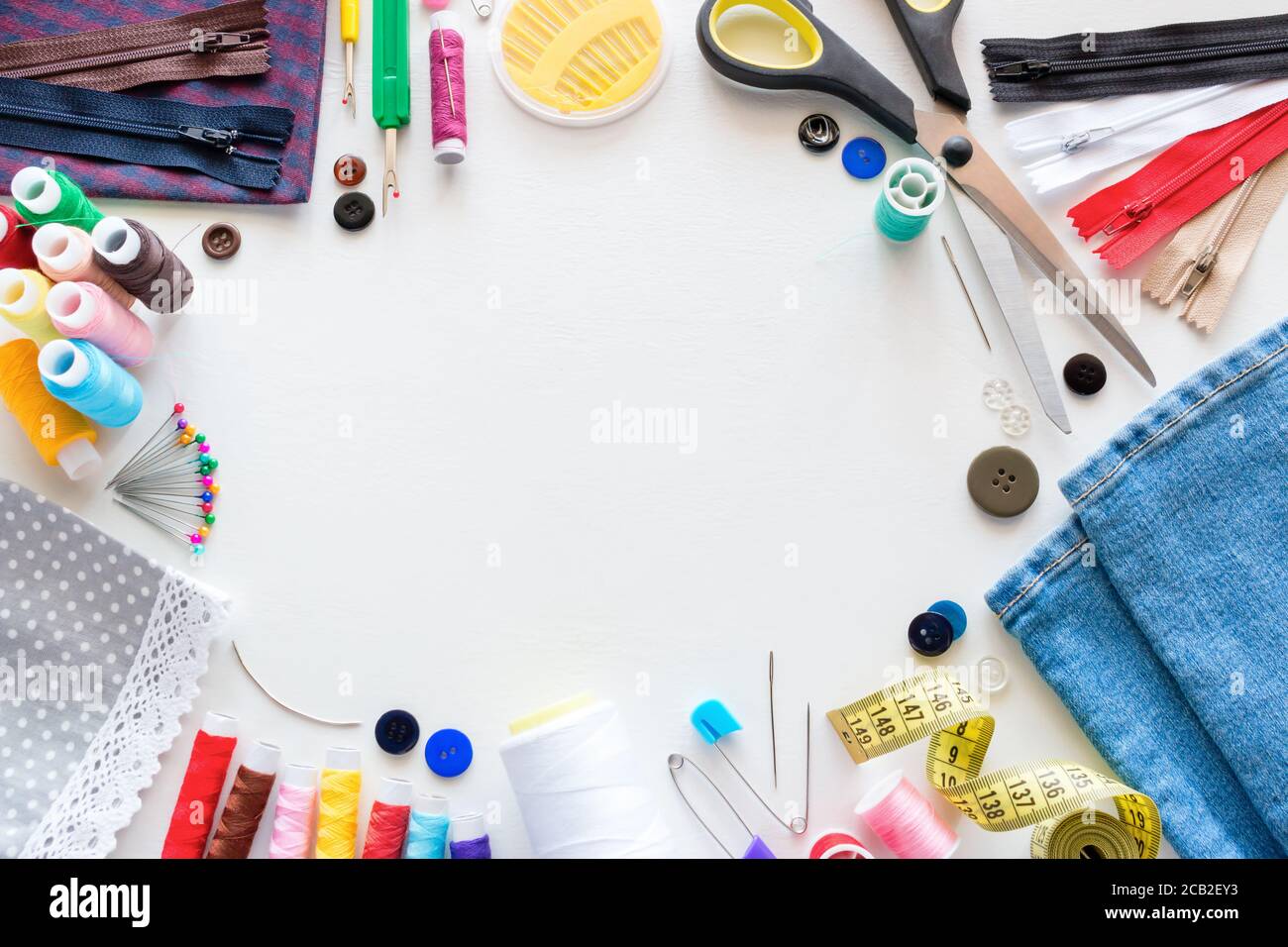 Sewing accessories frame for text on white background Stock Photo - Alamy