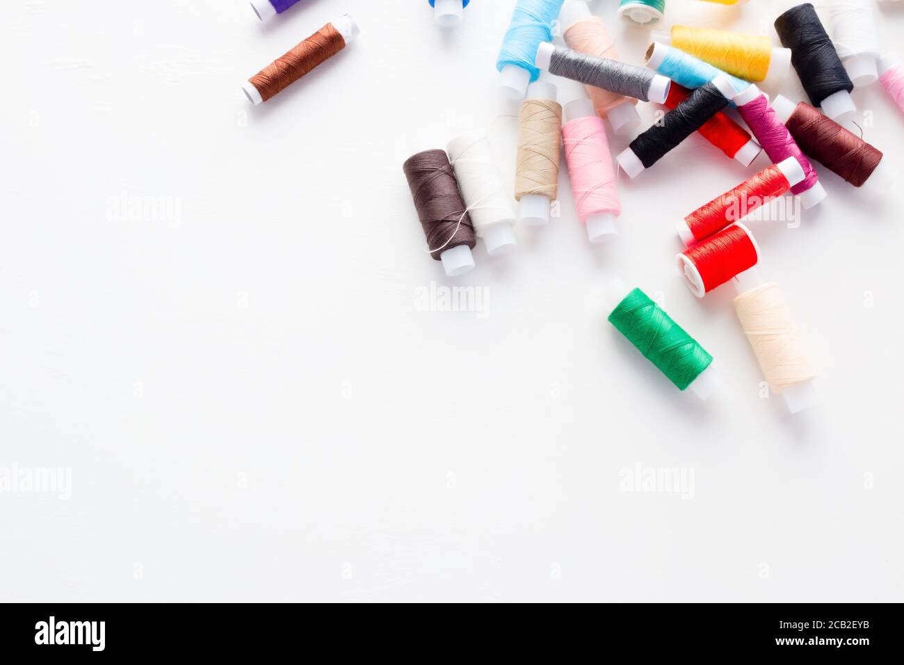 colored thread on a white background with space for text Stock Photo ...