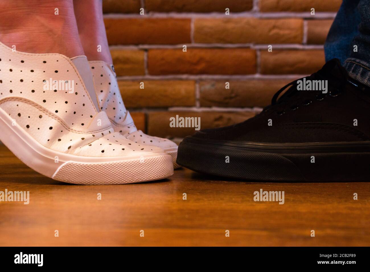the girl is on toes and kisses a man Stock Photo - Alamy