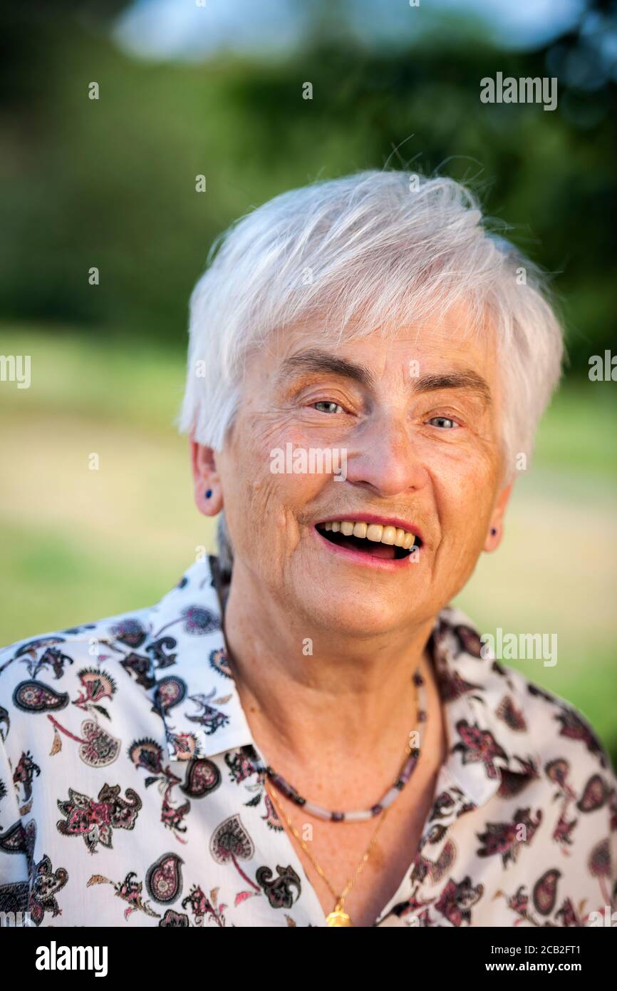 Head portrait of a 79 year old woman with white hair against the ...