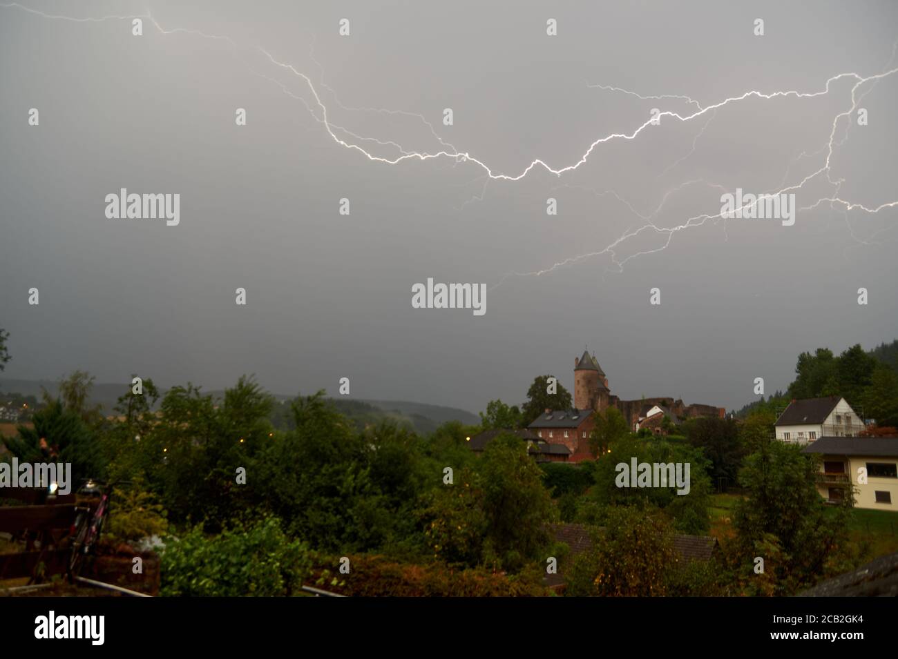 Castle photographed during a thunderstorm with lightning at night in ...