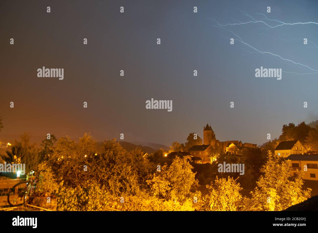 Castle photographed during a thunderstorm with lightning at night in ...