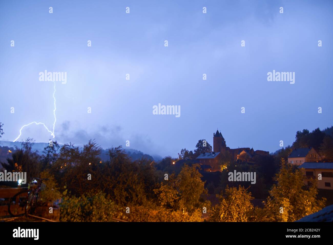 Castle photographed during a thunderstorm with lightning at night in ...