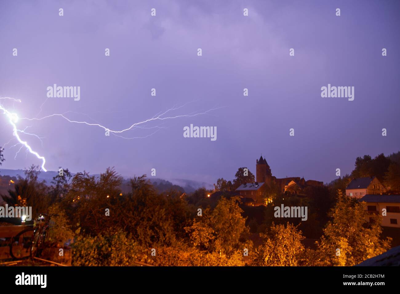 Castle photographed during a thunderstorm with lightning at night in ...