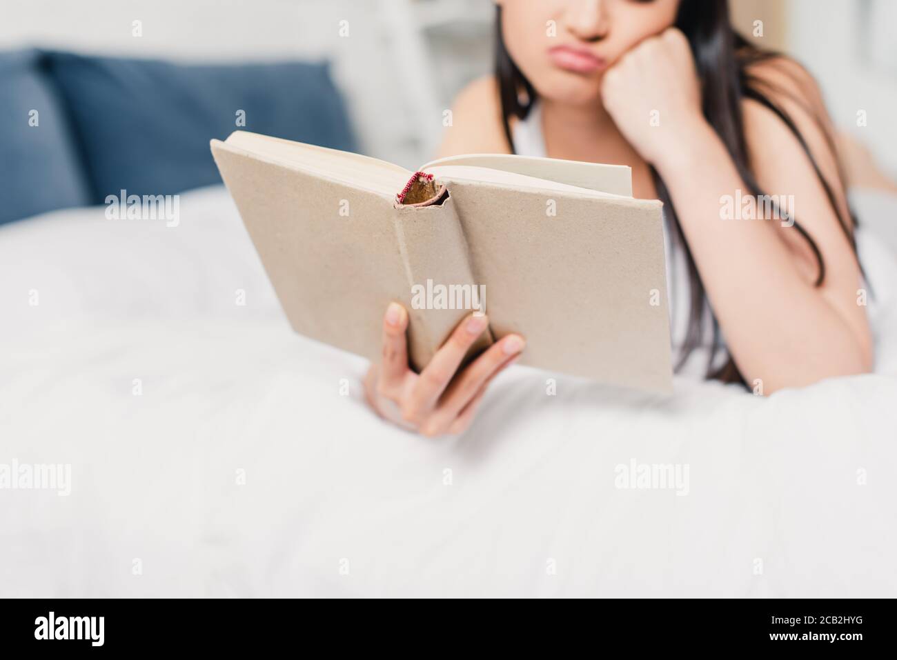 Hand resting on cheek hi-res stock photography and images - Alamy