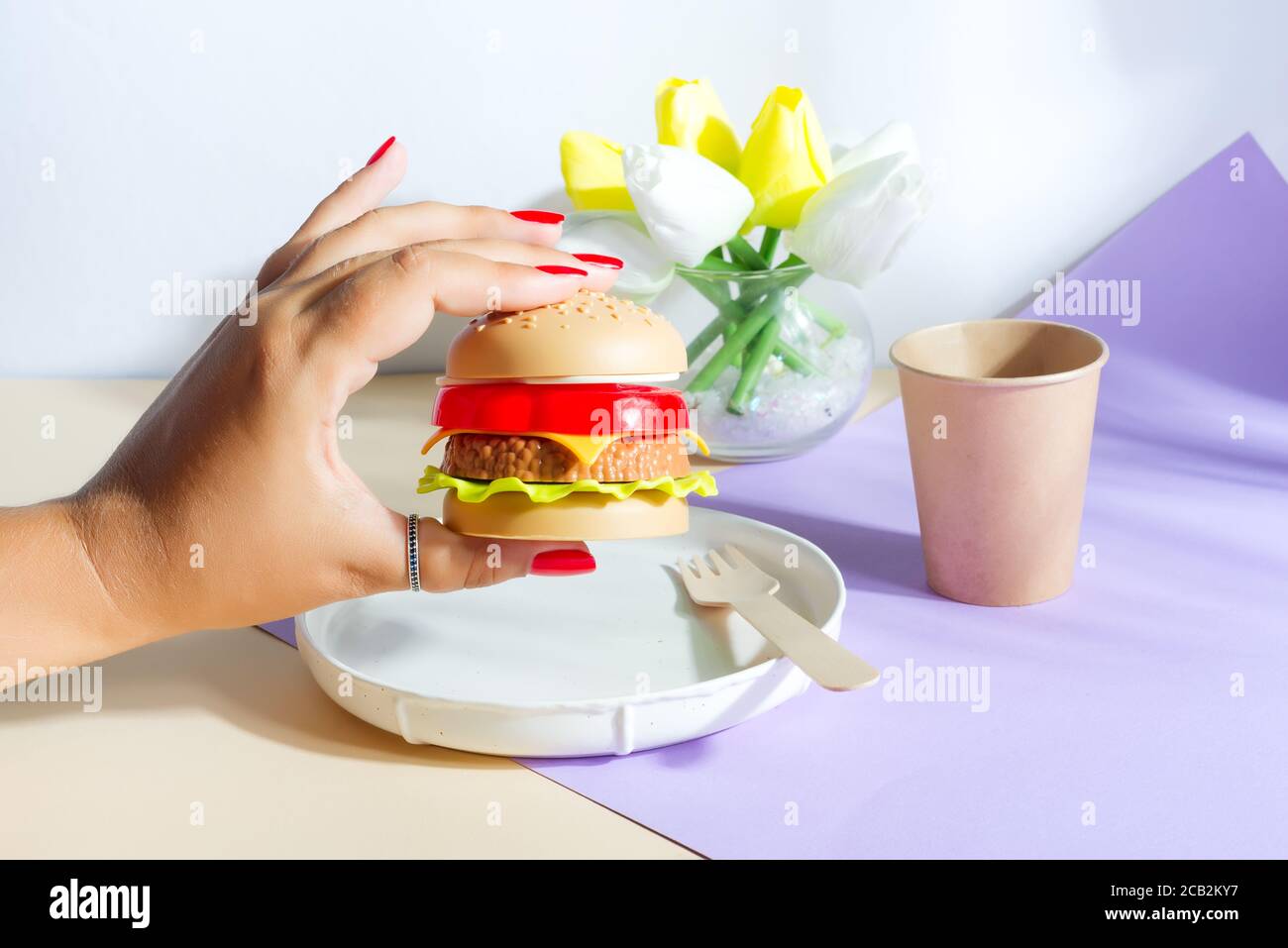 Dinner set served disposable plate, wooden fork, paper cup and womans ...