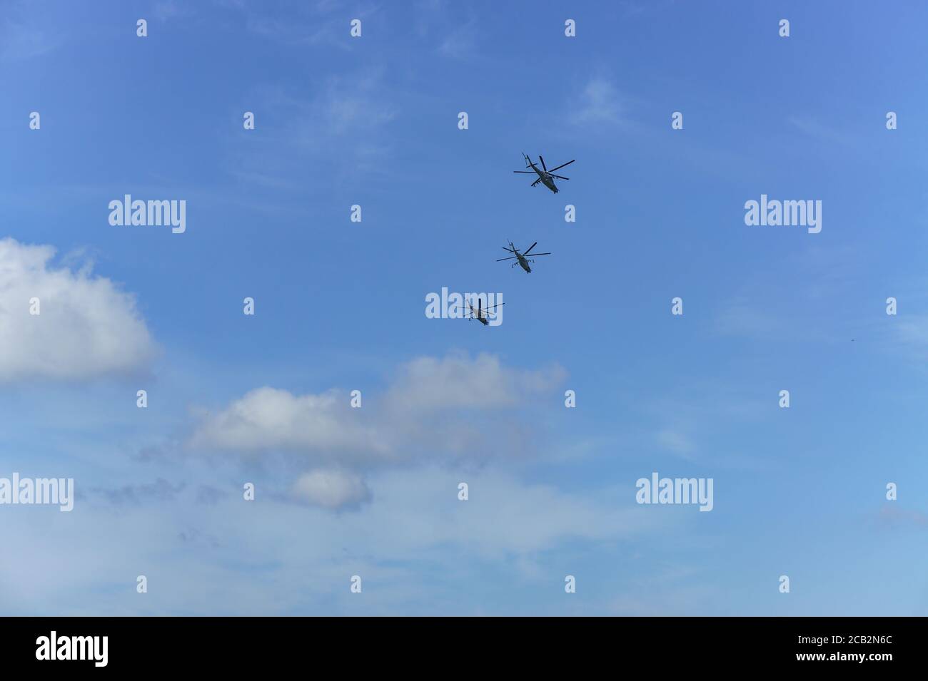 military helicopters in a cloudless sky, three helicopters in the sky ...