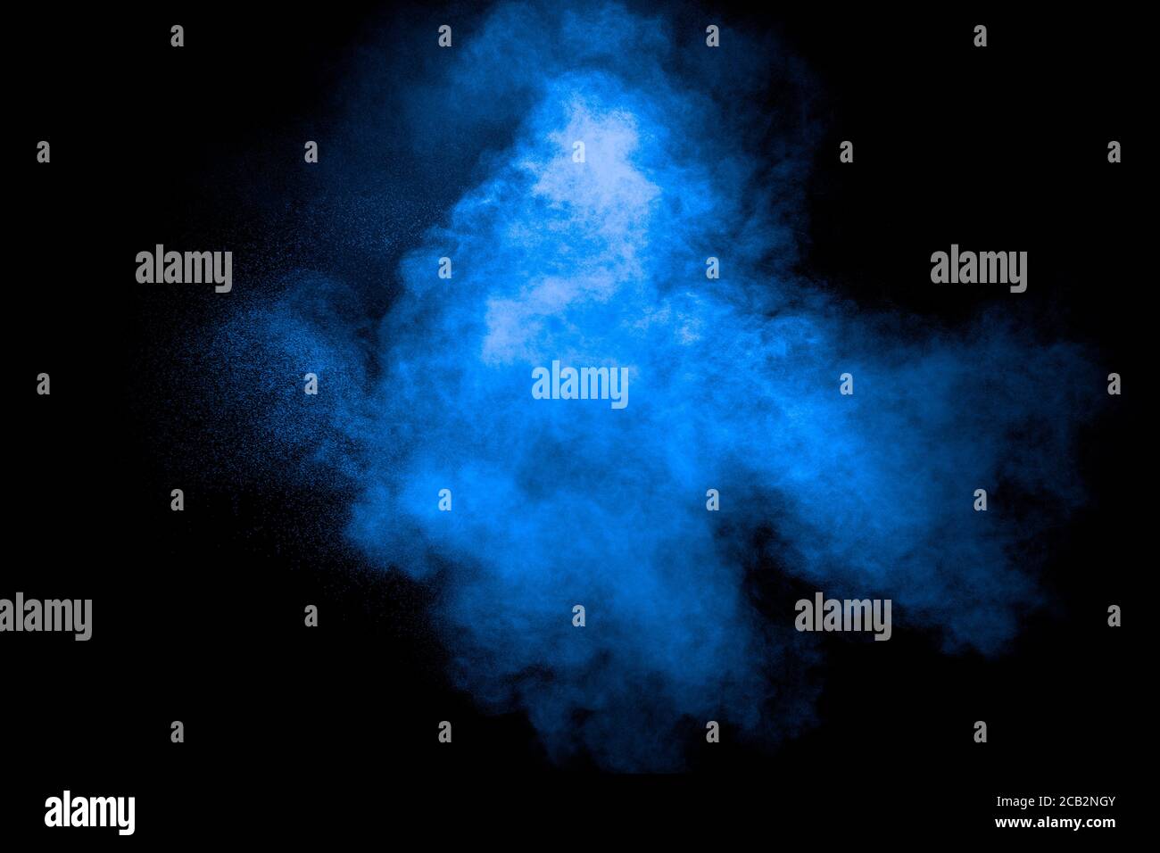 Blue color dust particles explosion cloud on black background.Color ...