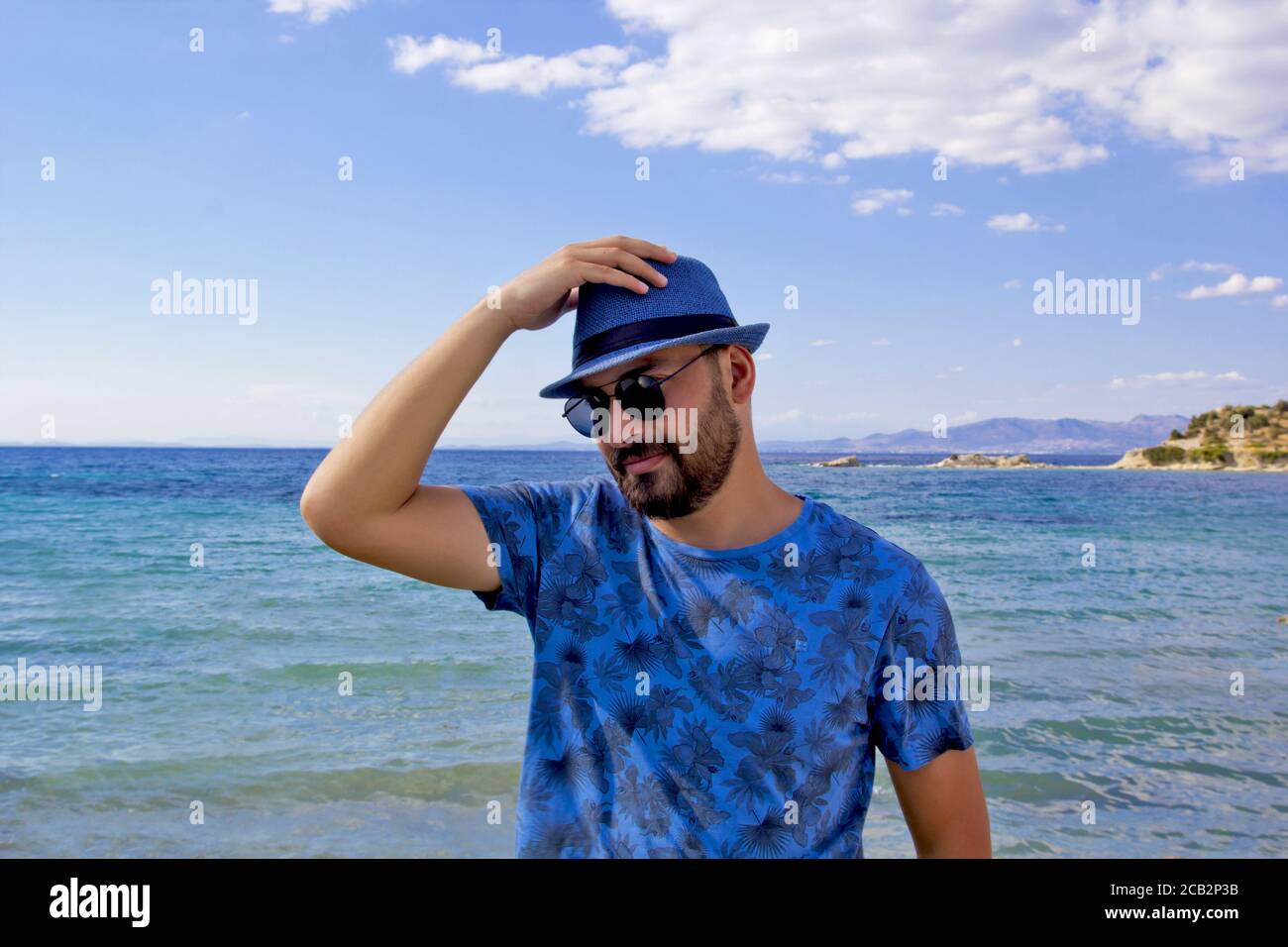 Man with blue hat hi-res stock photography and images - Alamy