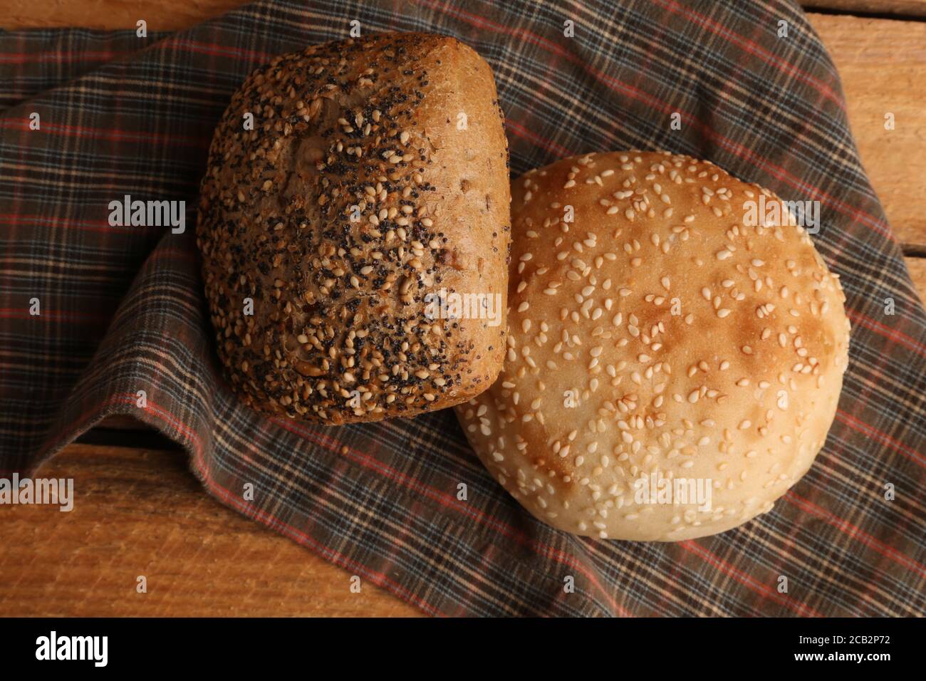 Overhead shot of bread buns on a fabric background Stock Photo - Alamy