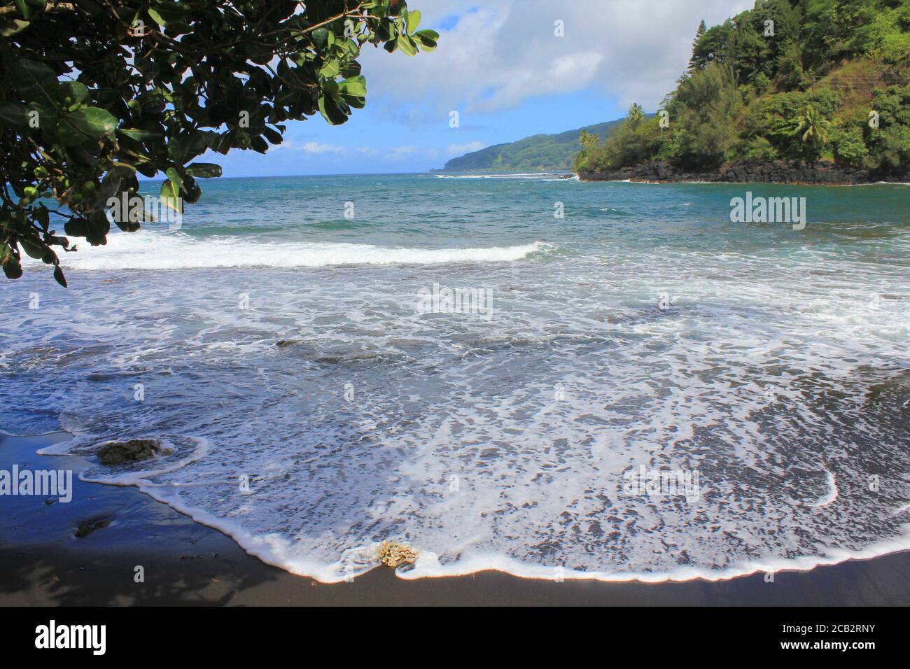 Black sand beach on Tahiti island, French Polynesia Stock Photo - Alamy