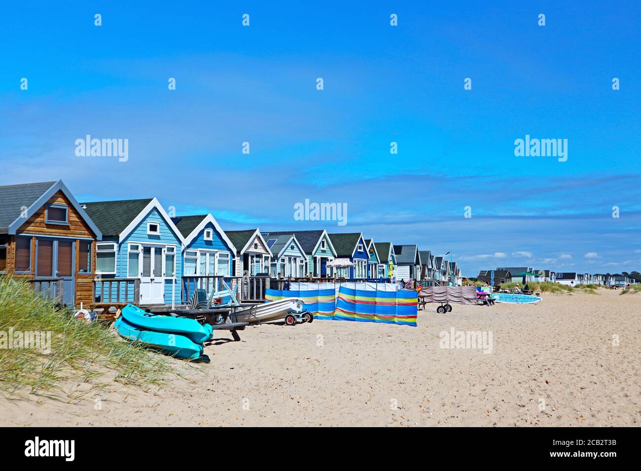 Beach huts on Mudeford sandbanks Stock Photo - Alamy