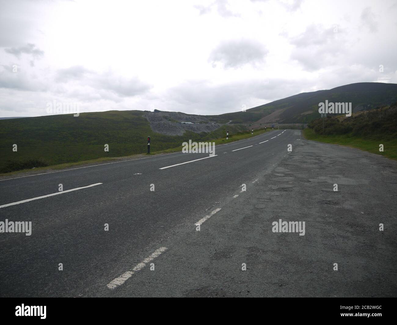 Empty Road Running Through Hillsides in the UK Stock Photo - Alamy