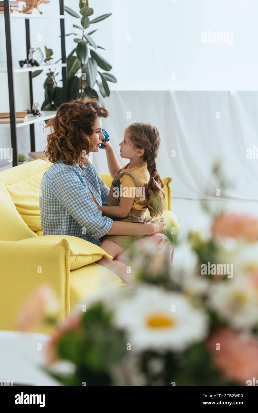 Sitting on laps hi-res stock photography and images - Alamy