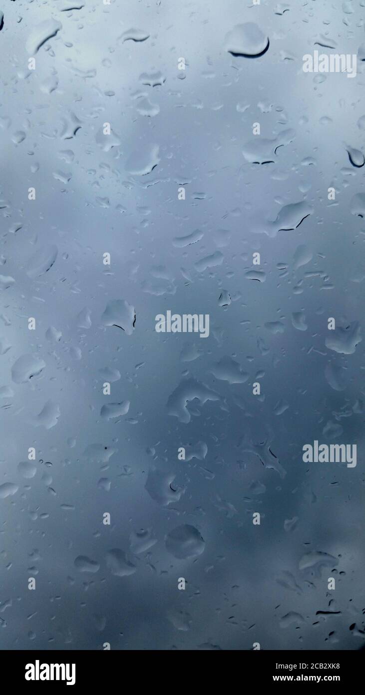 Vertical closeup shot of raindrops on a glass - perfect for a rainy ...