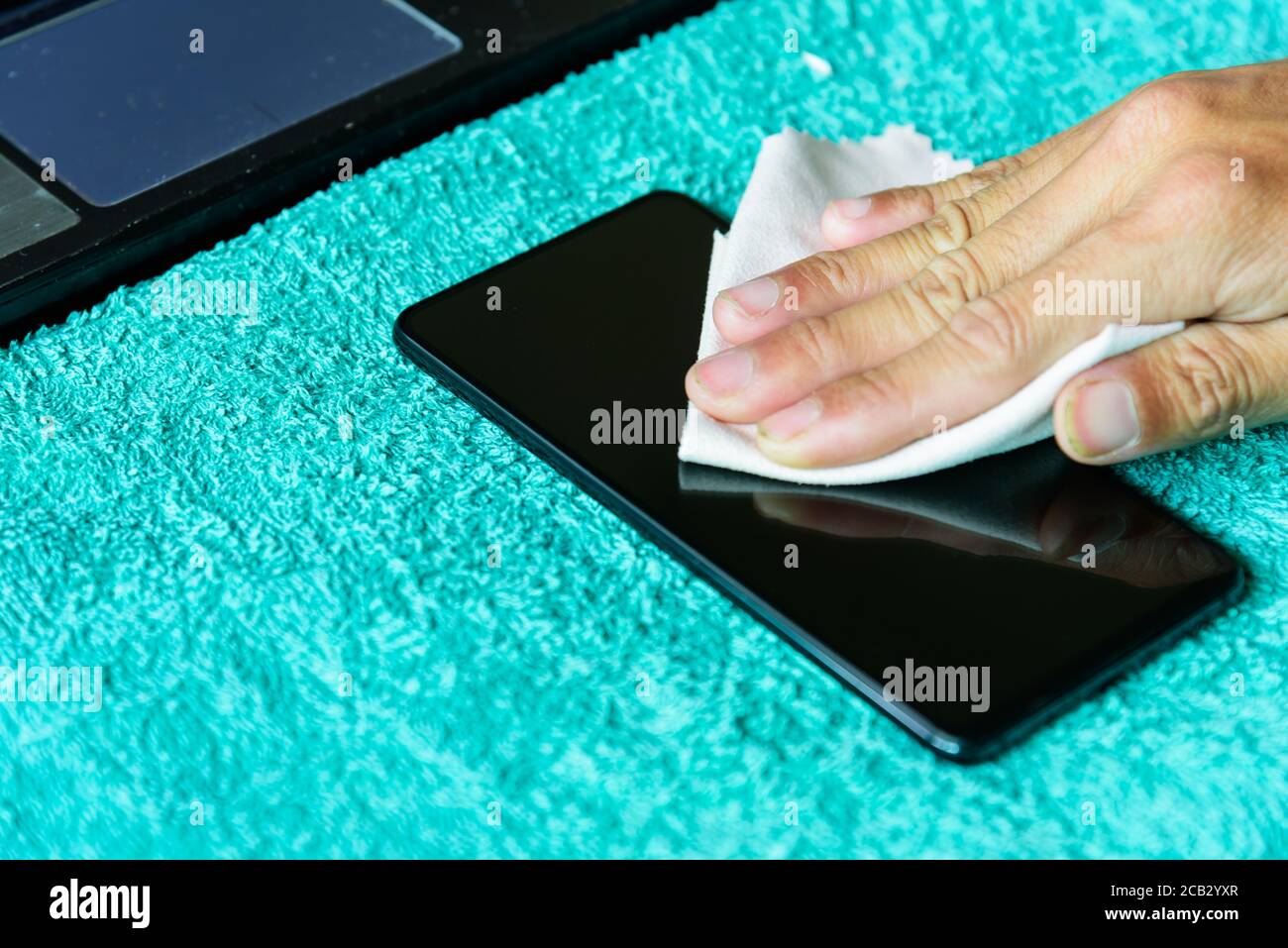 cleaning mobile phone screen by microfiber cloth. Before apply the ...