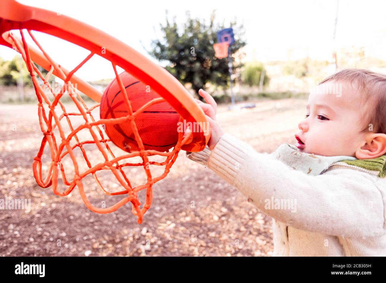 Little cute girl playing basketball hi-res stock photography and images ...