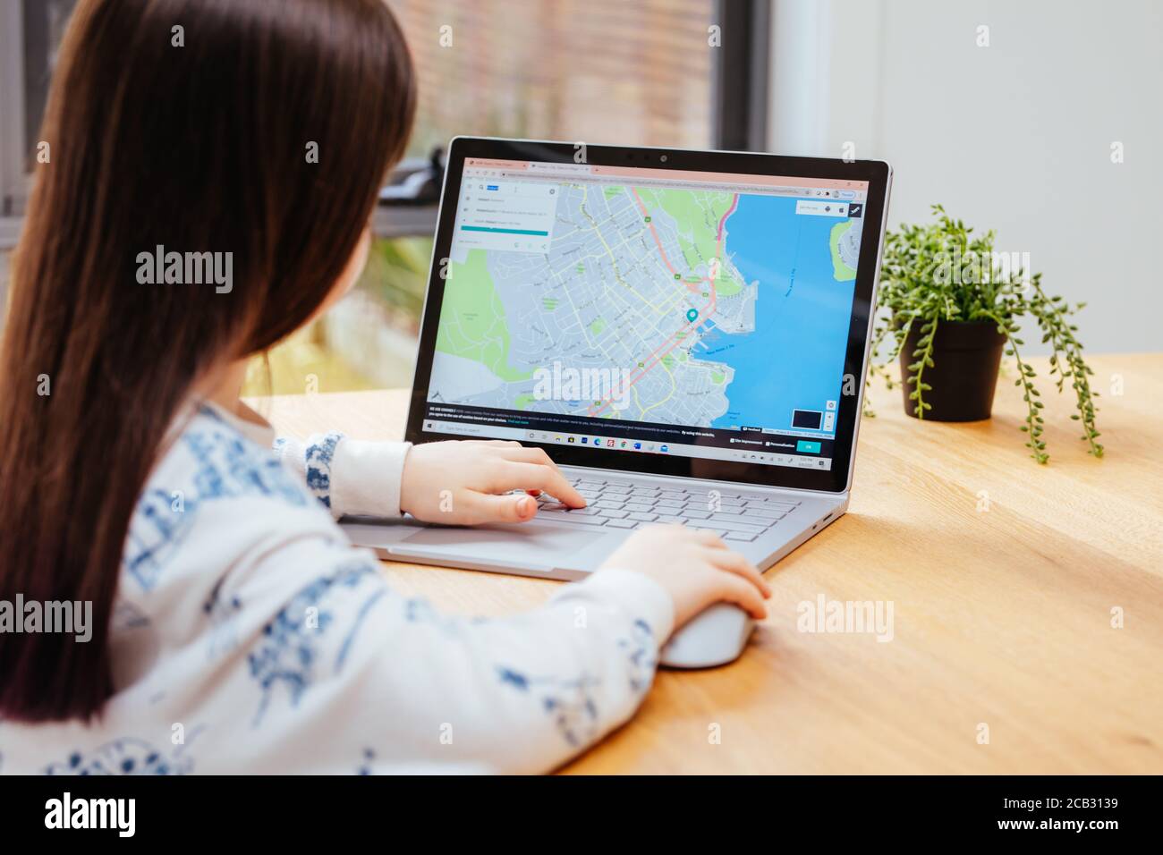 Child Uses a Computer for School Work Stock Photo - Alamy