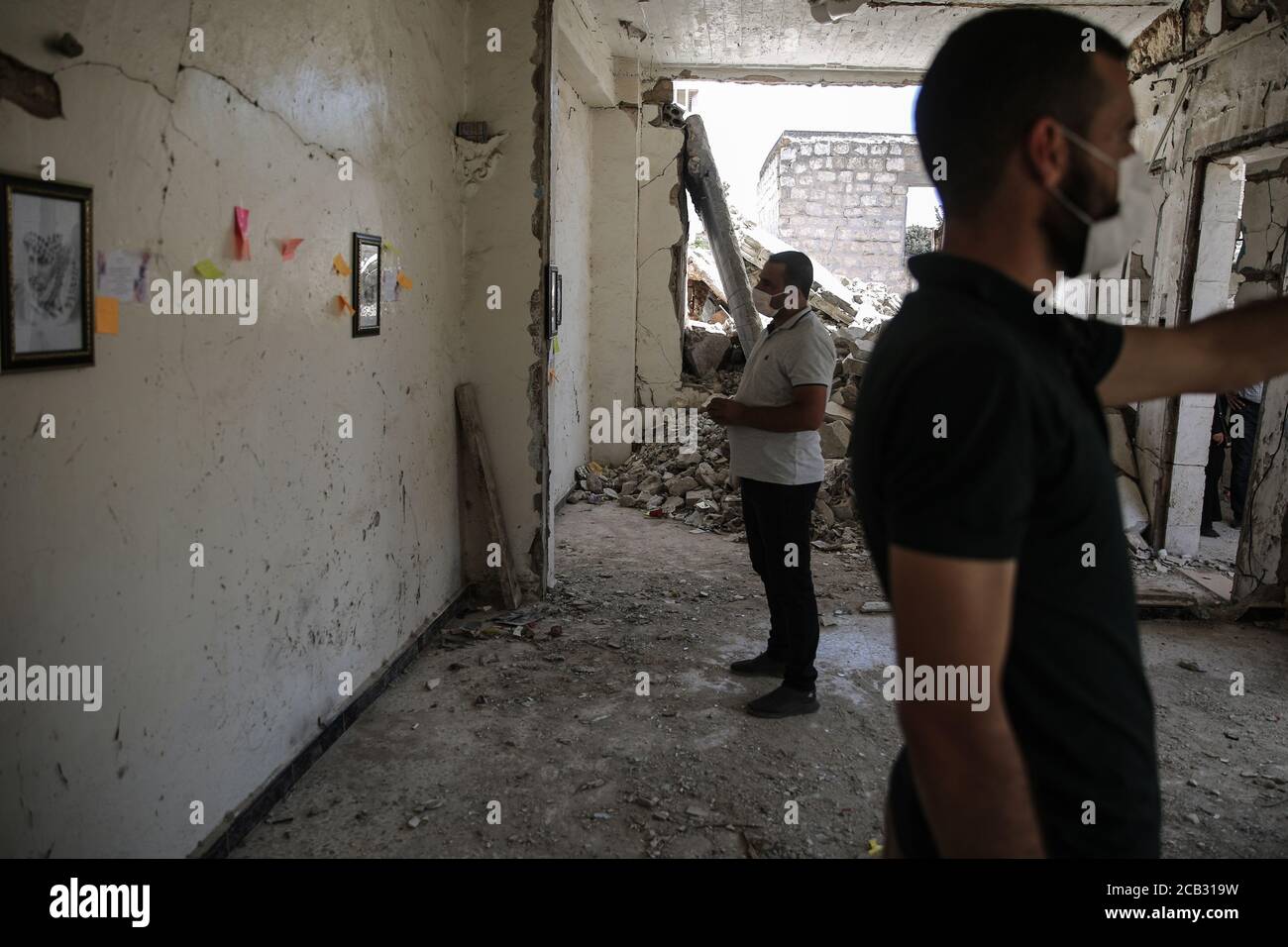 Idlib City, Syria. 10th Aug, 2020. Visitors tour an exhibition set up ...