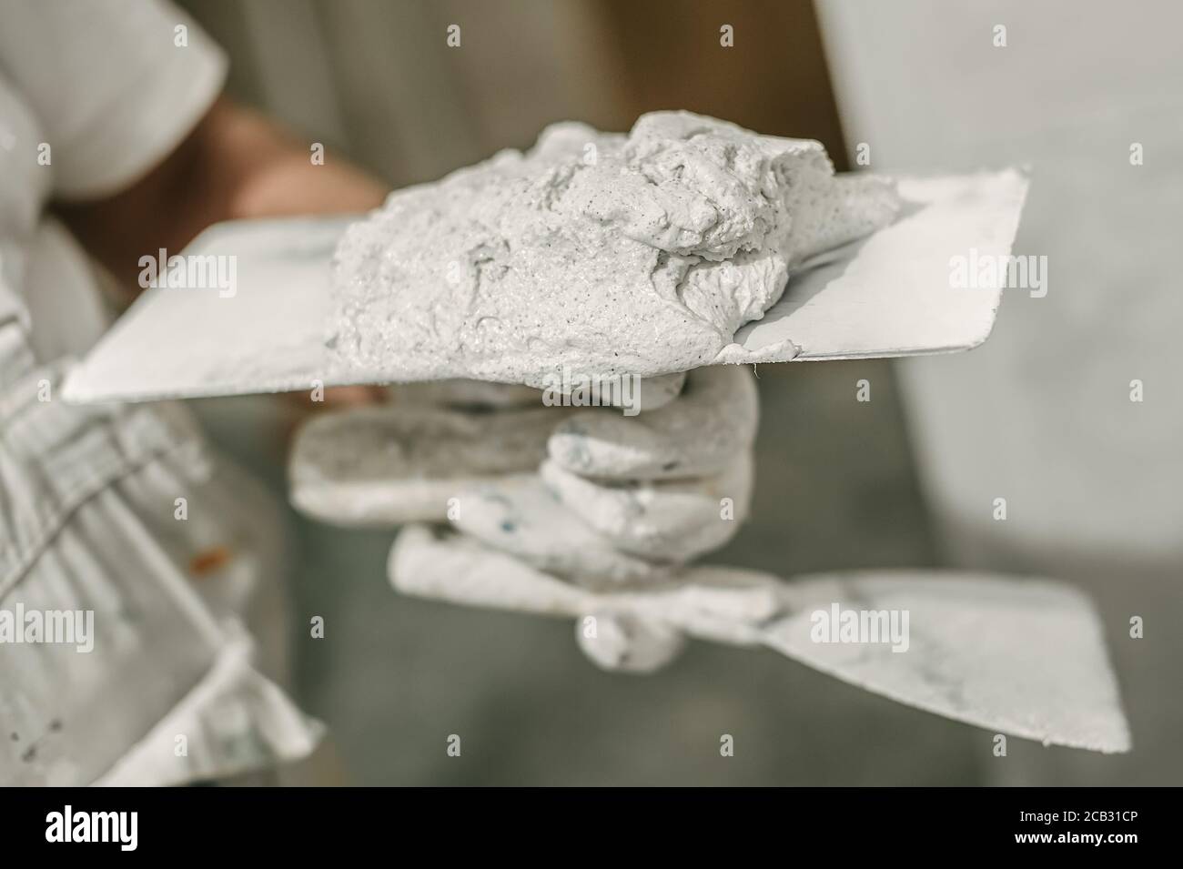 Construction mason worker with spatula and mortar. Construction tools ...