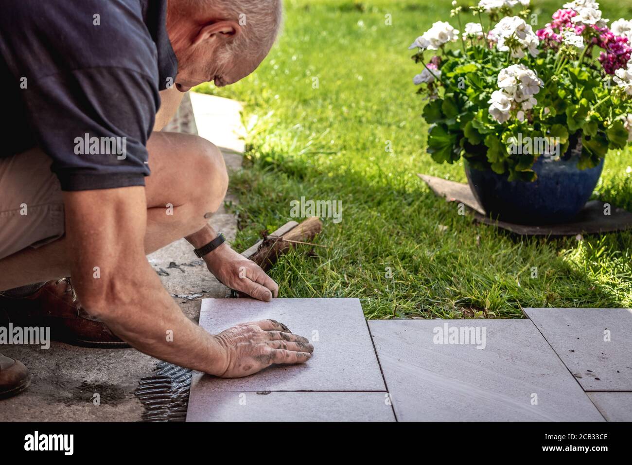 Man working on tile installation hi-res stock photography and images ...