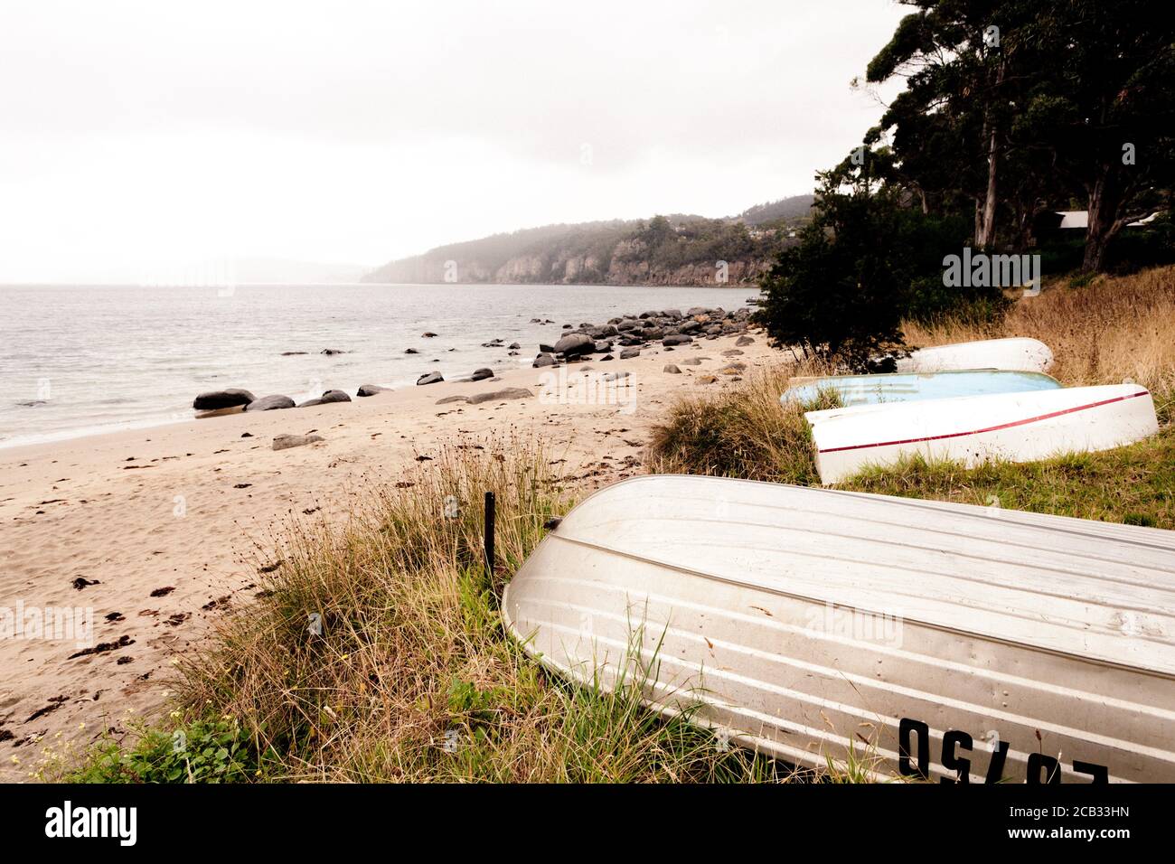 Boats on Taroona beach in winter Stock Photo - Alamy