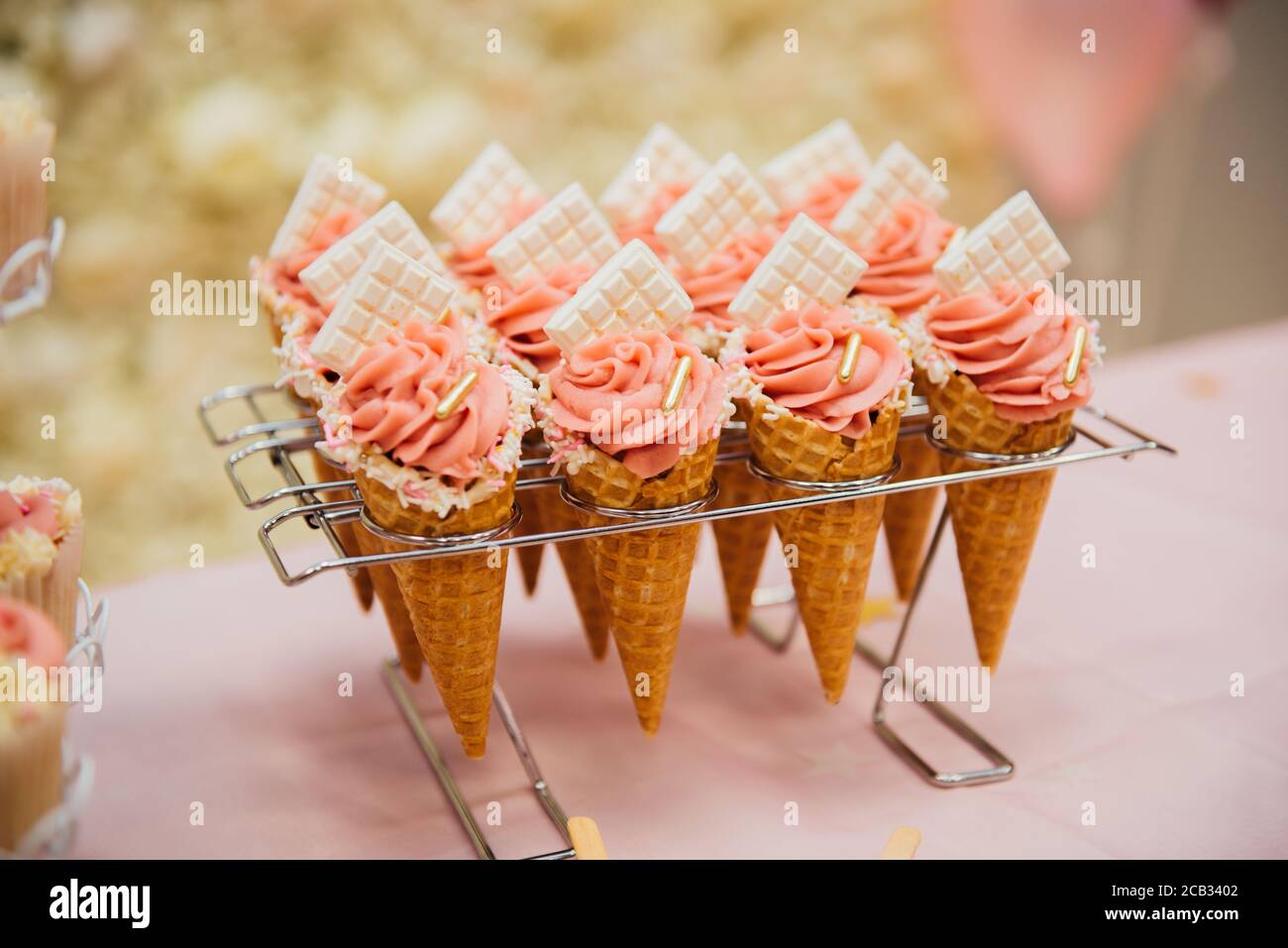 ice cream cone cakes on table Stock Photo - Alamy