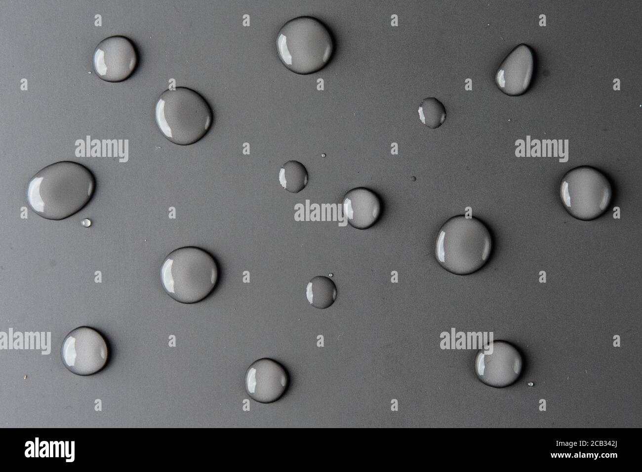 Water droplets on flat grey surface Stock Photo - Alamy