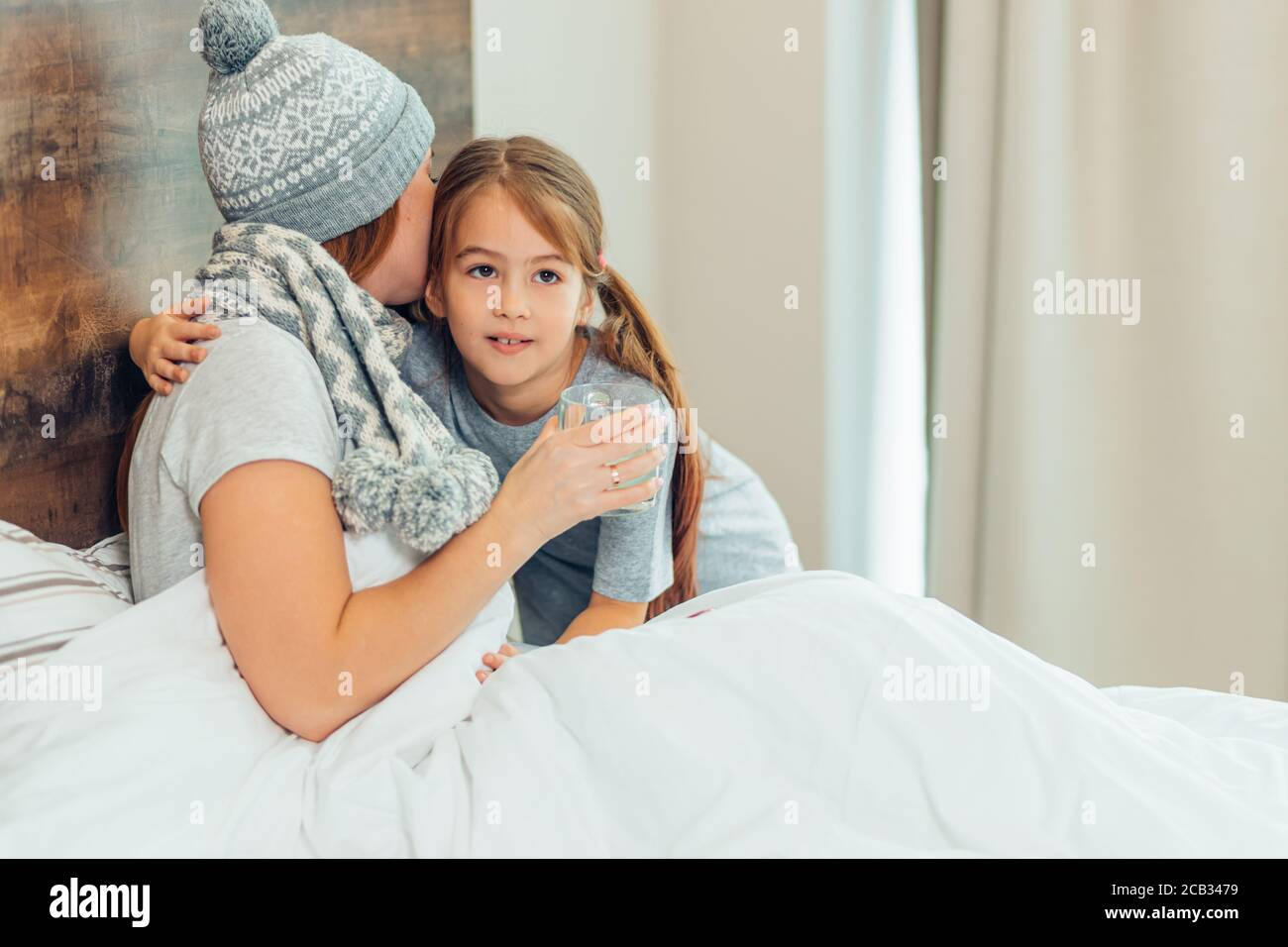 Sick mother hugging children hi-res stock photography and images - Alamy