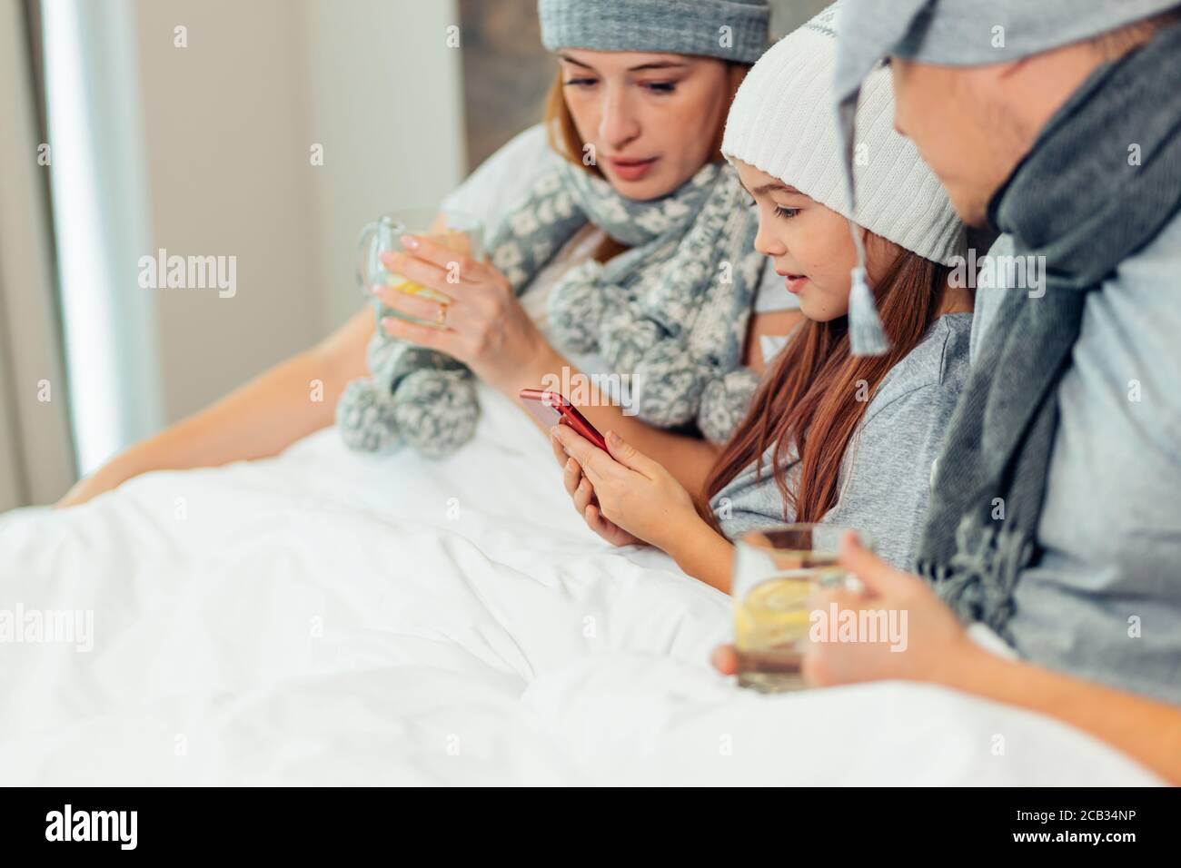 caucasian family stay at home using medicines, drinking vitamines on ...