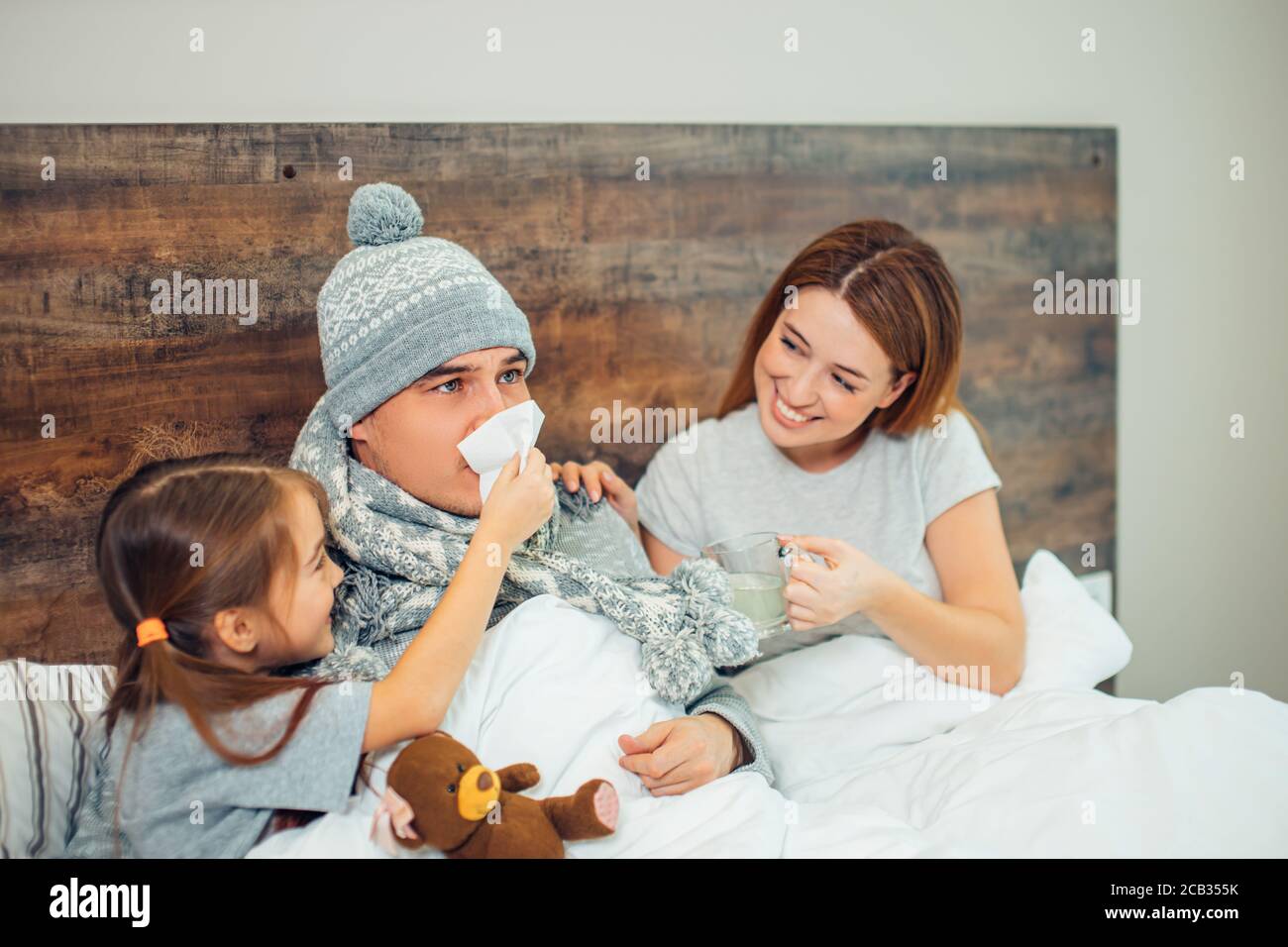 careful caucasian kid girl givehandkerchief to father, successful ...