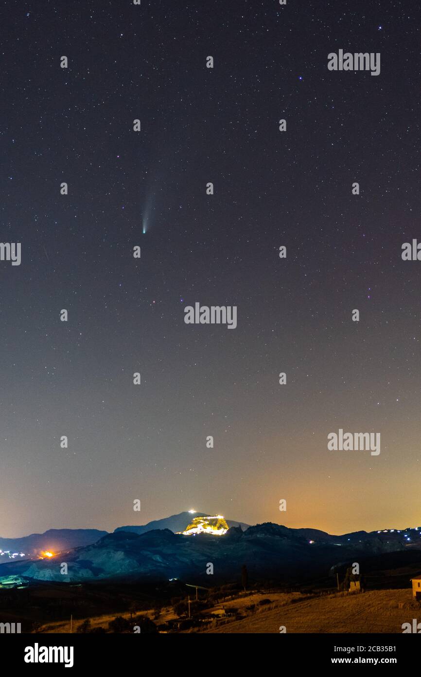 Neowise Comet and its long dust above Sutera medieval town Stock Photo ...