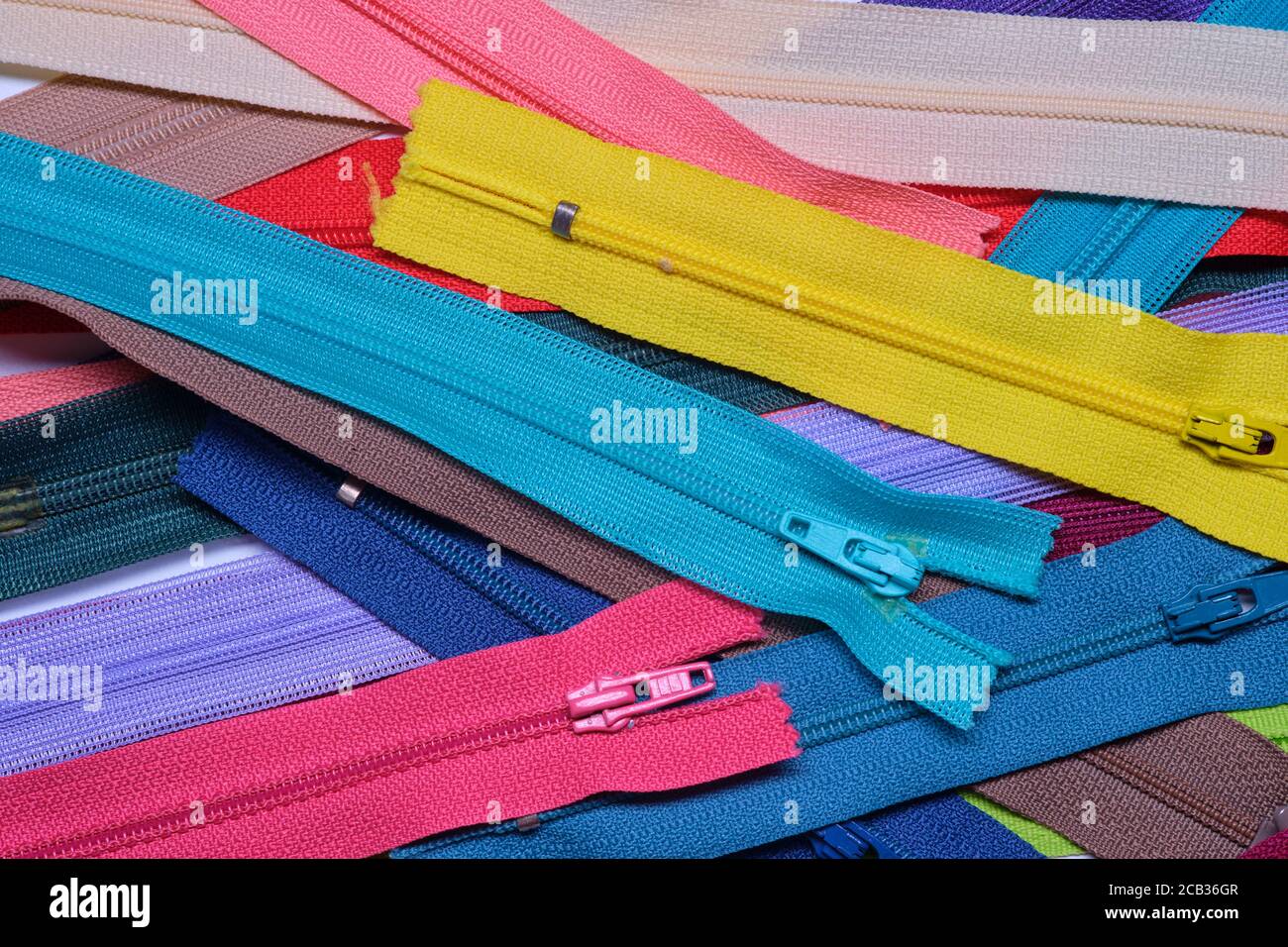 Colorful zipper for sewing and arrange as a background Stock Photo - Alamy