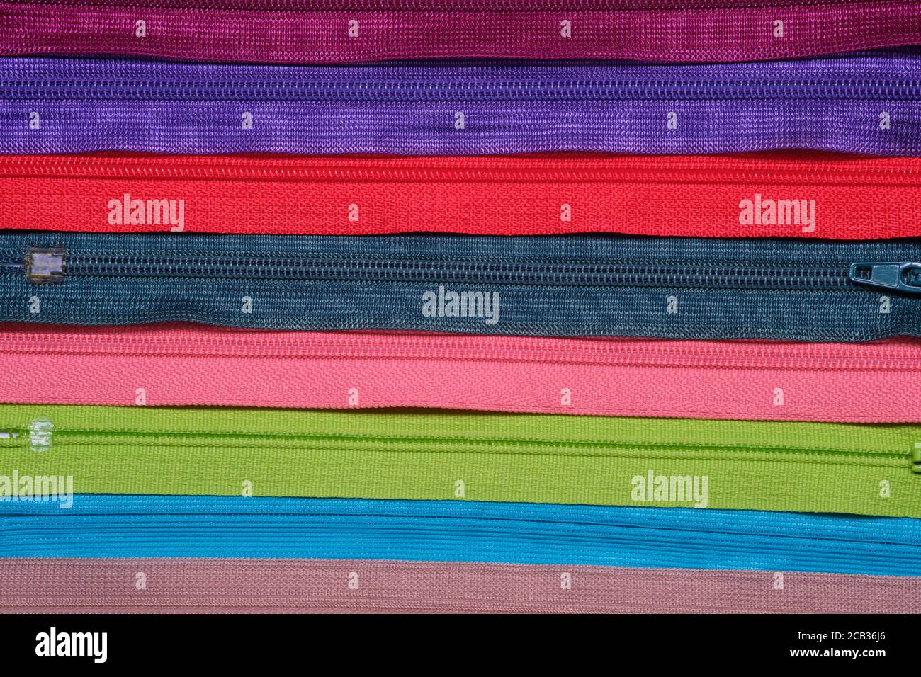 Colorful zipper for sewing and arrange as a background Stock Photo - Alamy