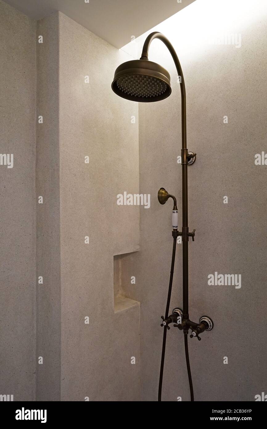 Antique bronze shower in marbled bathroom Stock Photo - Alamy