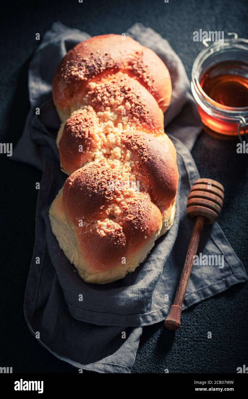 Fresh challah on dark table for breakfast Stock Photo - Alamy