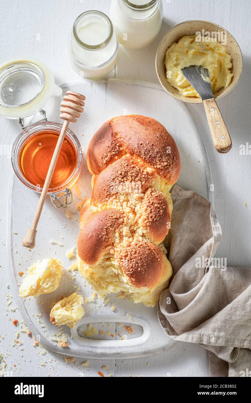 Sweet challah with honey and milk for breakfast Stock Photo - Alamy