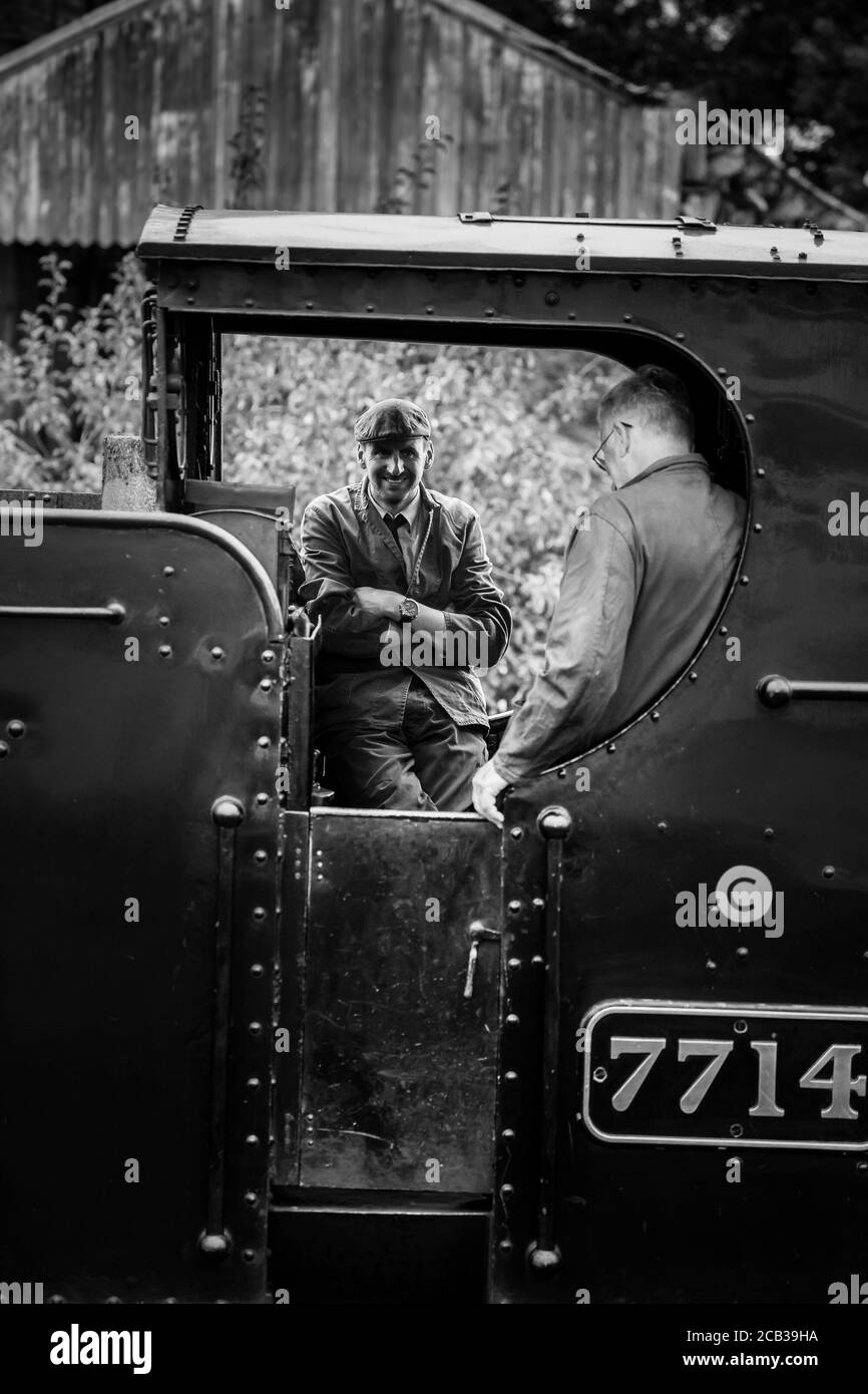 Monochrome, side view close up of vintage steam locomotive cab with ...