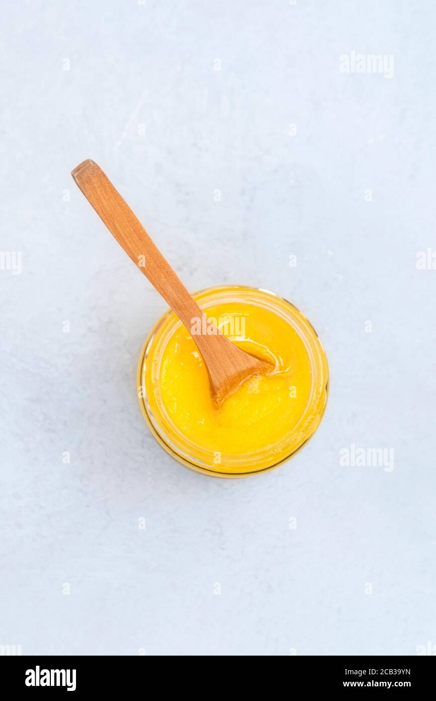 Top view of vegetarian ghee butter on neutral background Stock Photo ...