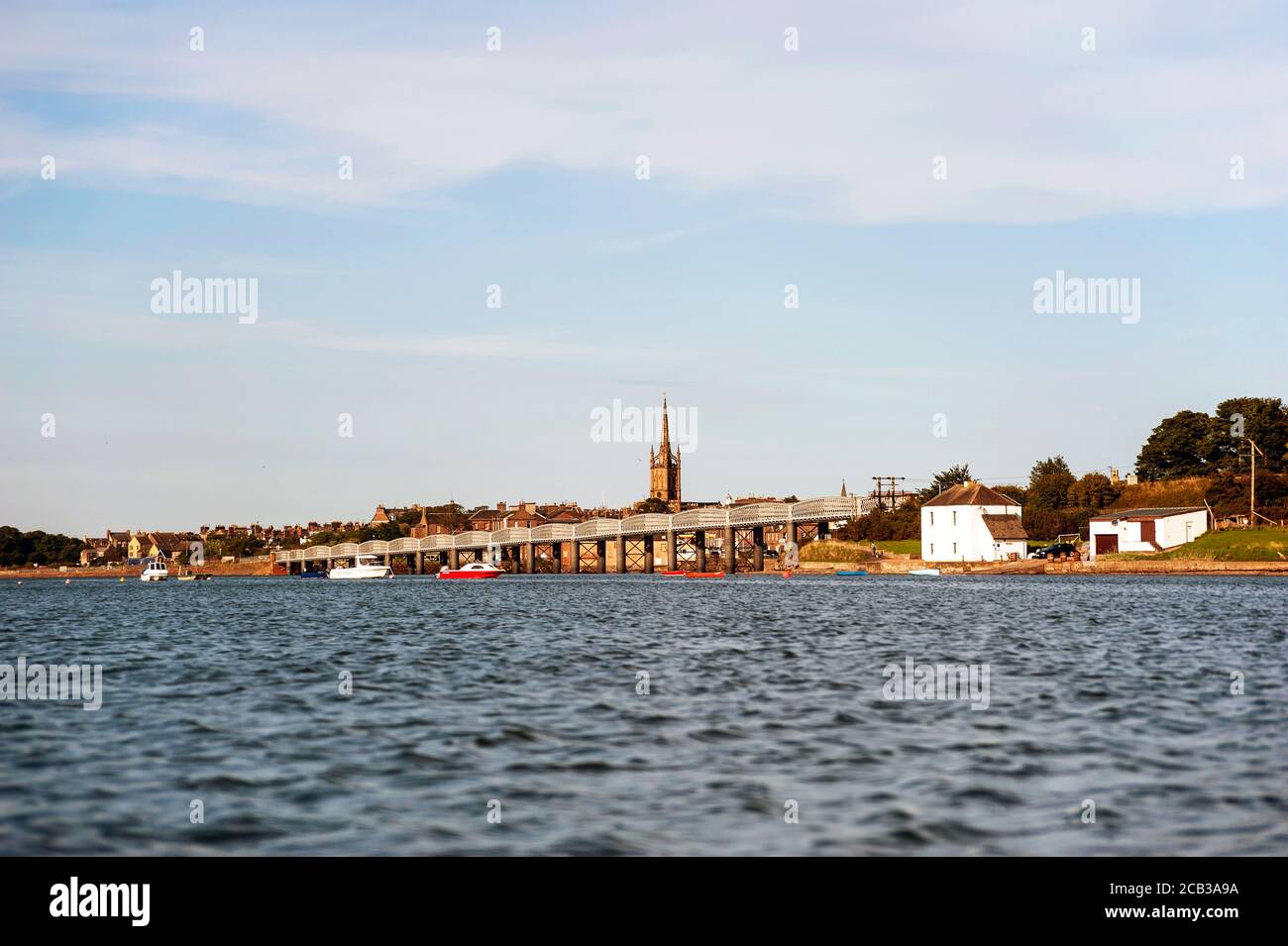 Landscape image from Montrose basin of the railway bridge with road ...