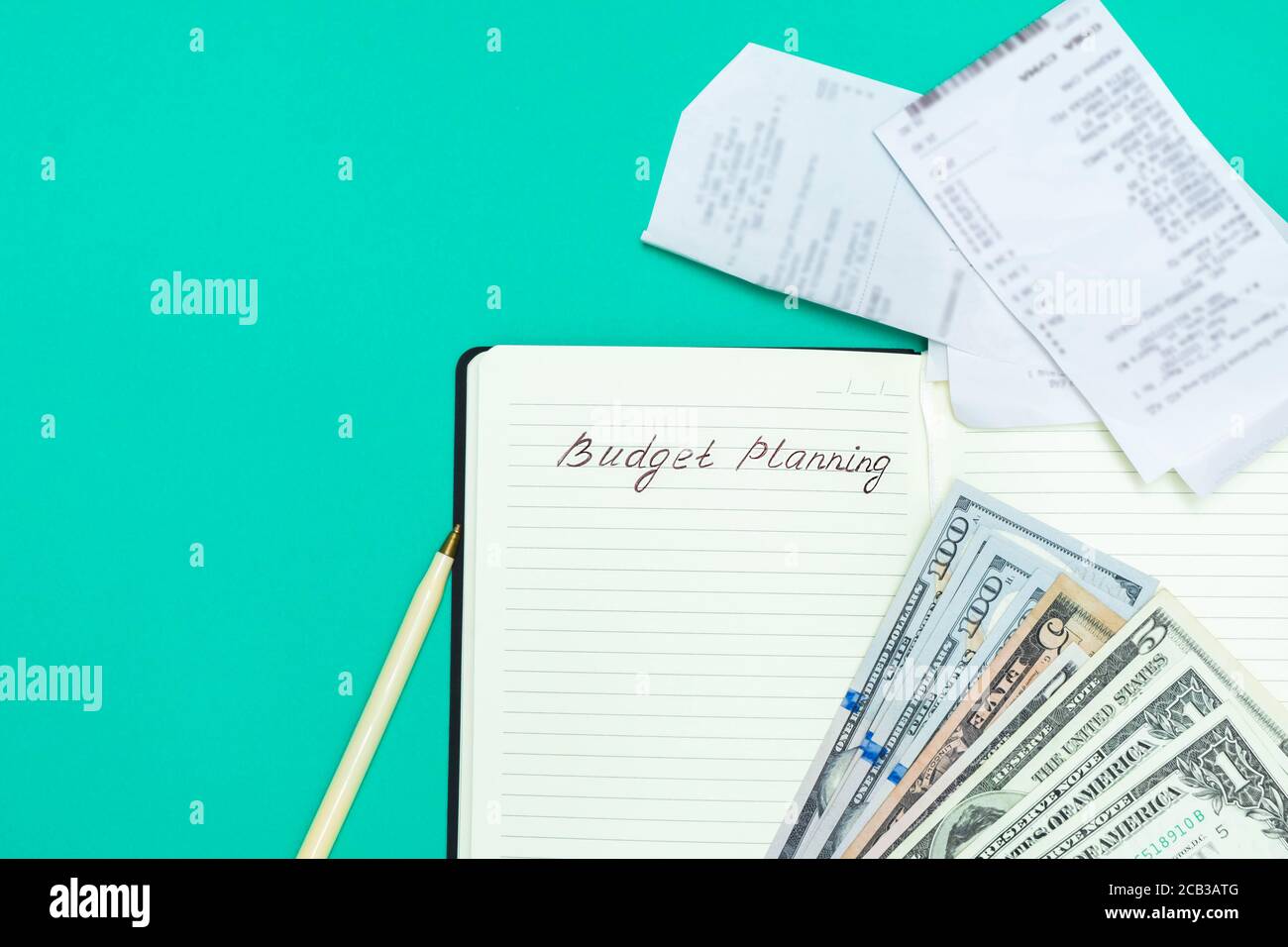 Budget accounting concept. Money, pen, receipts and notepad with ...
