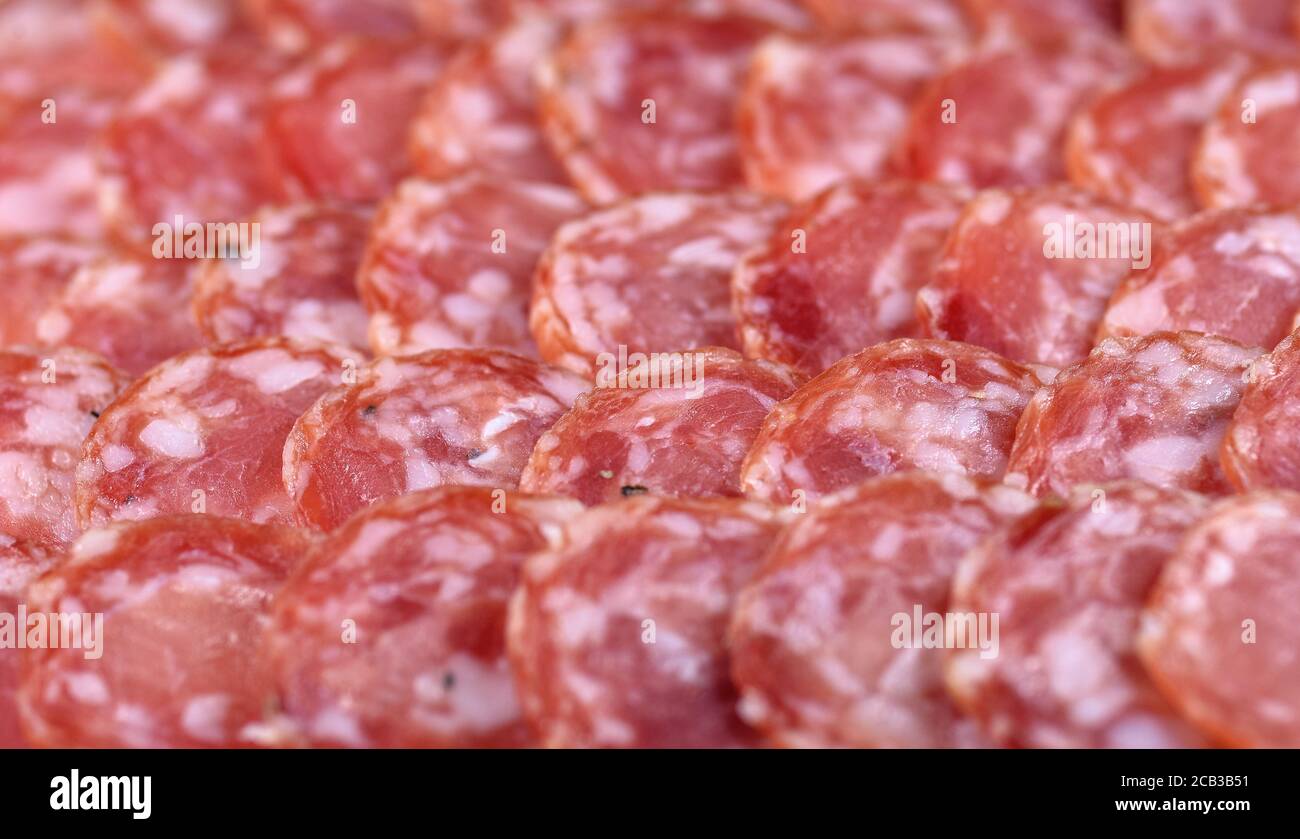 Salami sausage slices background. Close up. Slices of smoked sausage ...