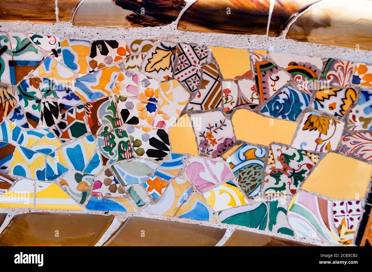 Antonio Gaudi's mosaic tile bench at Park Guell in Barcelona, Spain ...